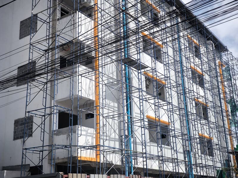 Building Under Construction. Scaffolding on Building Facade Stock Image ...