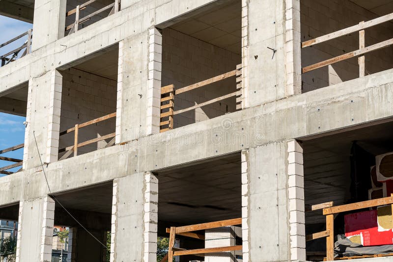 Building Under Construction. Tower Cranes Constructing a New Building. Industrial Background ...