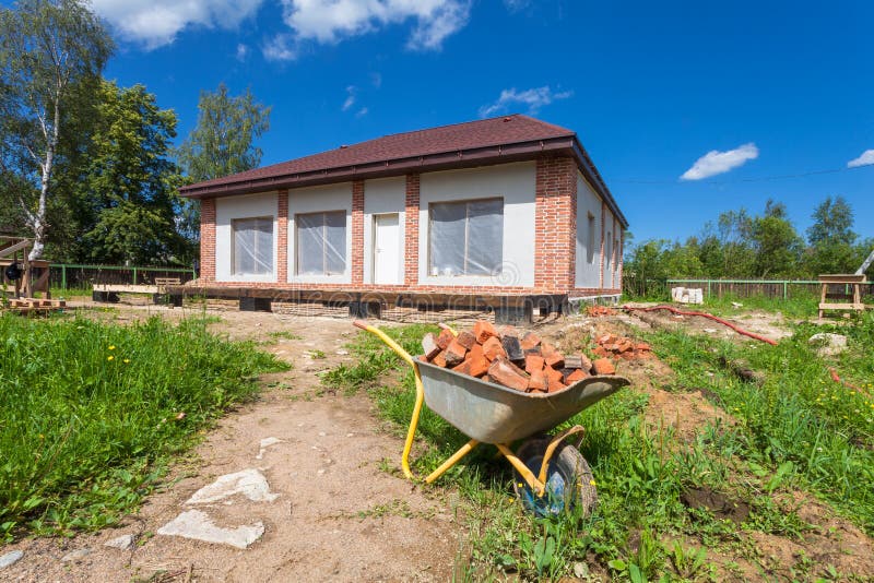 The Building is Under Construction and Trolley with Bricks Stock Image ...