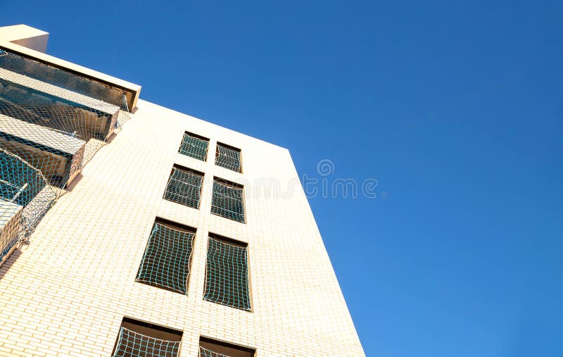 A Building Under Construction with Windows and Balconies are Against a ...