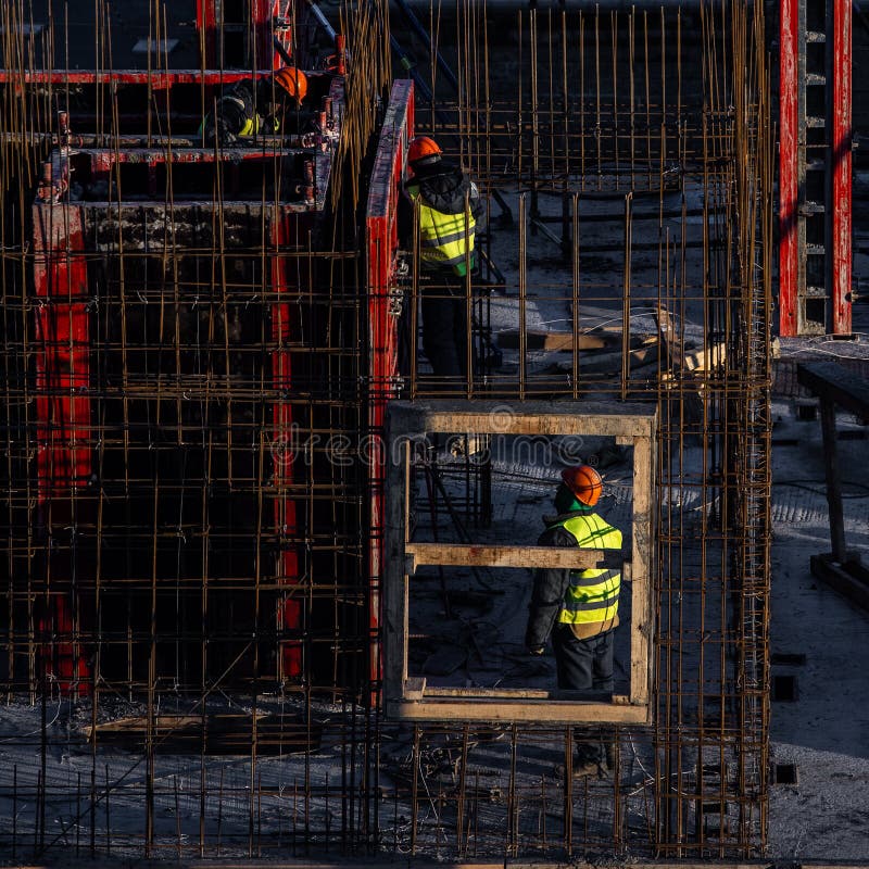 Building Under Construction and Workers on a Cold Day Stock Photo ...