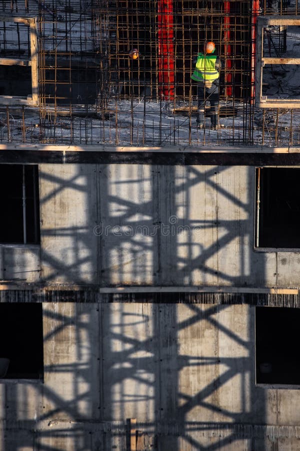 Building Under Construction and Workers on a Cold Day Stock Photo ...