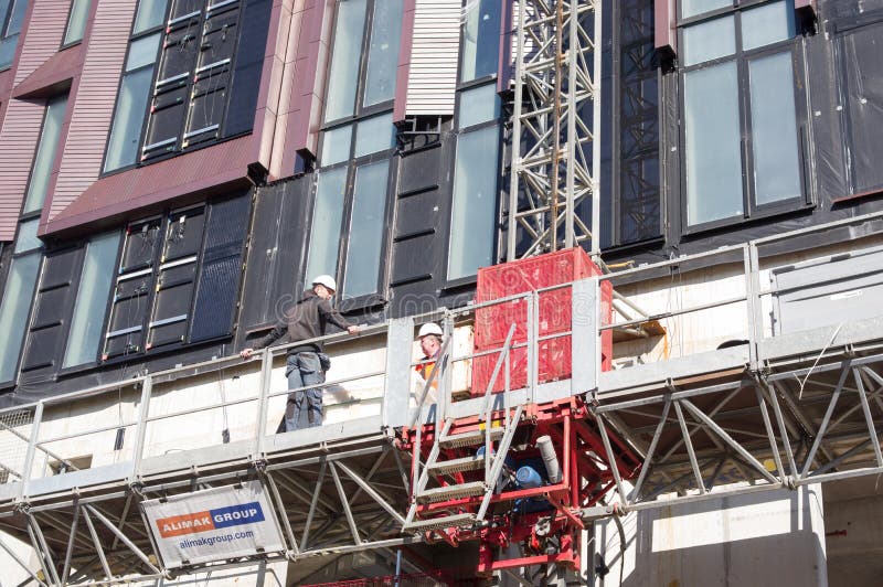 Building Under Construction with Workers at Work Editorial Stock Photo ...