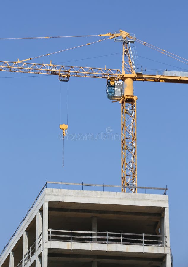 Building Under Construction and a Yellow Crane Stock Photo - Image of ...