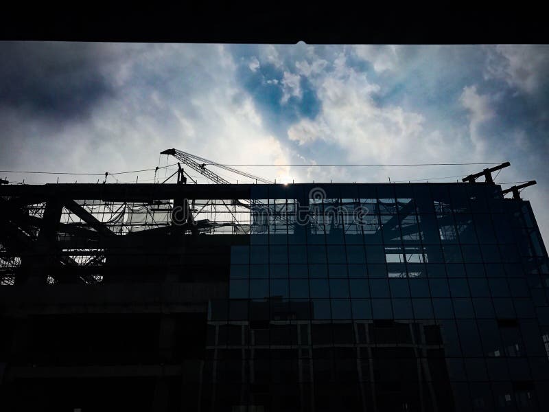 Building stock photo. Image of building, cloud, crane - 115009678