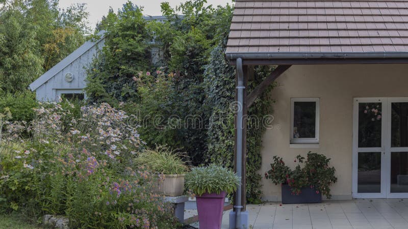 Building with Verander and Flower Garden Stock Image - Image of ...