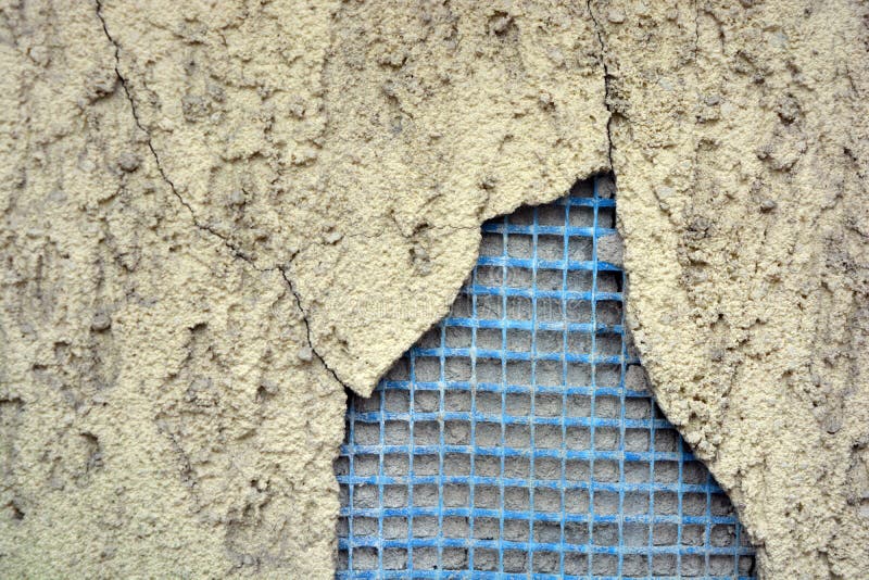 The Building Wall Cladding is Made of Brown Textured, Structural ...