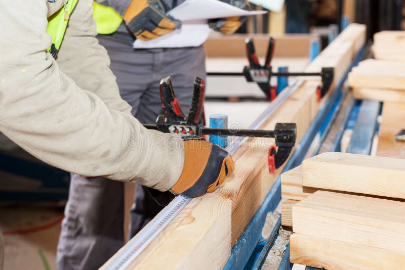 Building a Wall for Frame House. Worker Make Marks for Cutting Timber ...