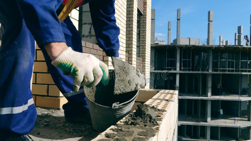 Building Wall is Getting Constructed by Two Backlit Engineers Stock ...
