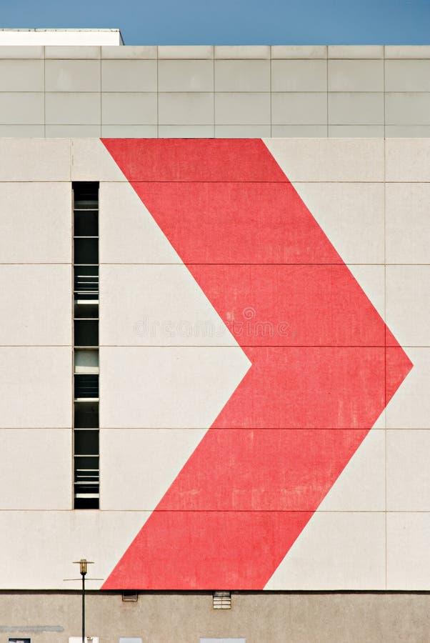 Building Wall with Red Arrow Stock Image - Image of empty, large: 14609533