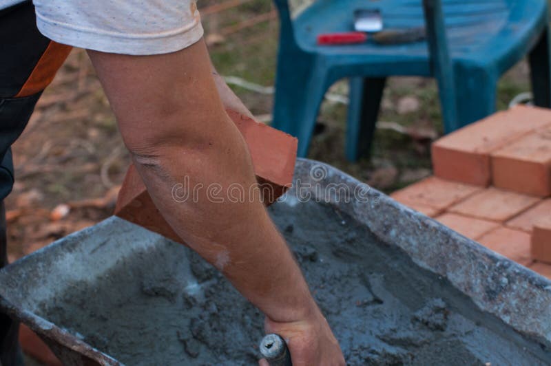 Building a Wall with Red Brick. Working with Bricks for Building a Wall ...