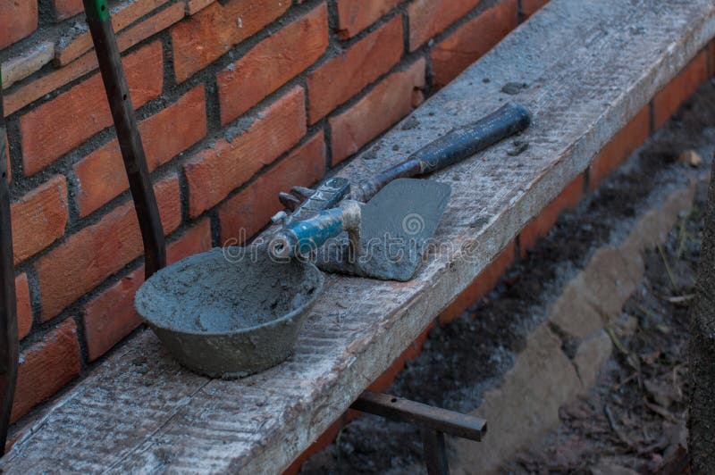 Building a Wall with Red Brick. Working with Bricks for Building a Wall ...