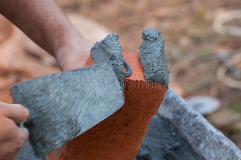 Building a Wall with Red Brick. Working with Bricks for Building a Wall ...