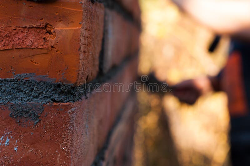 Building a Wall with Red Brick. Working with Bricks for Building a Wall ...