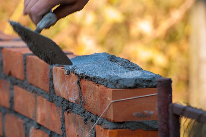 Building a Wall with Red Brick. Working with Bricks for Building a Wall ...