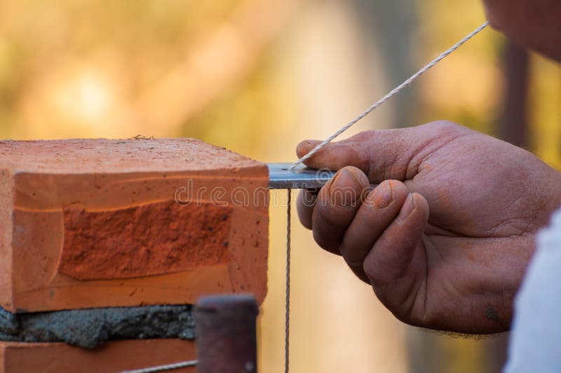 Building a Wall with Red Brick. Working with Bricks for Building a Wall ...