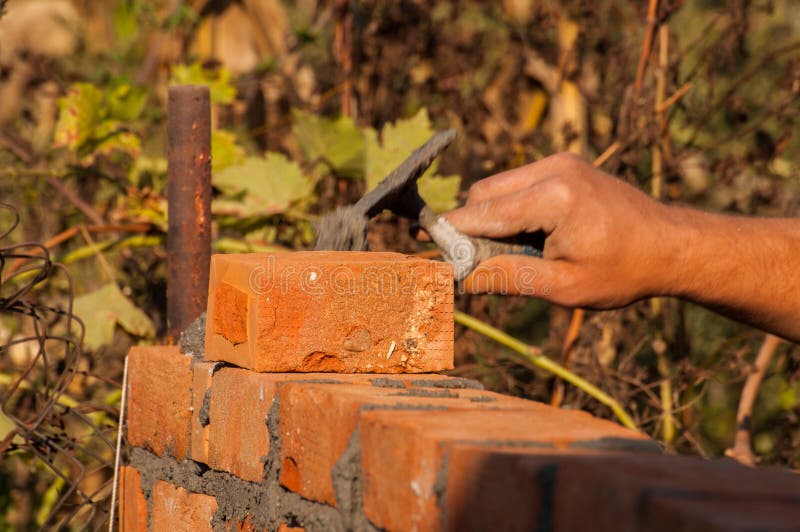 Building a Wall with Red Brick. Working with Bricks for Building a Wall ...