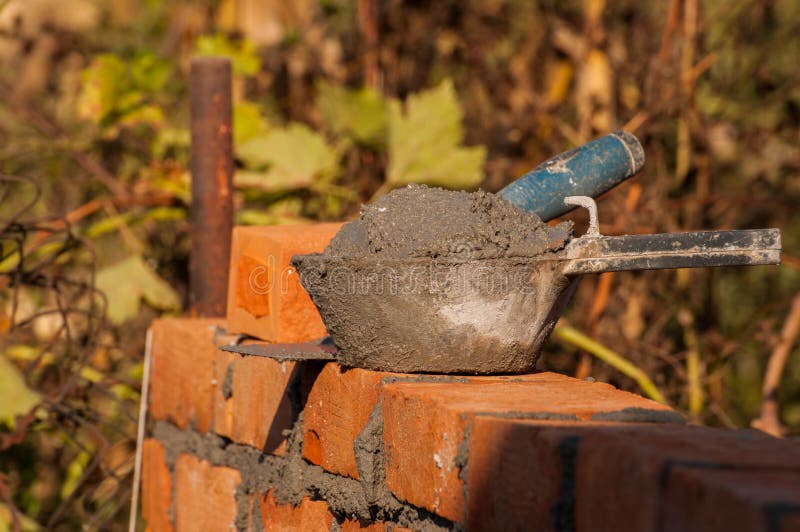 Building a Wall with Red Brick. Working with Bricks for Building a Wall ...