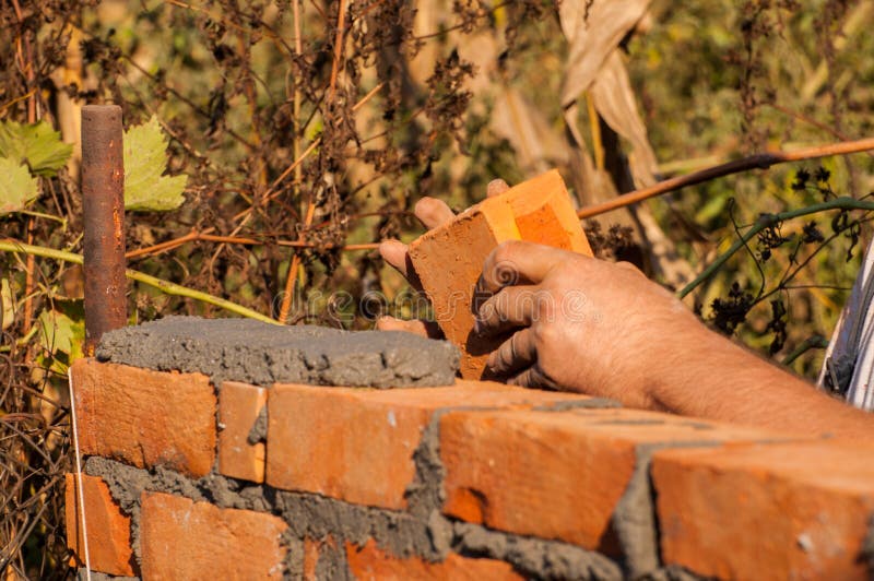 Building a Wall with Red Brick. Working with Bricks for Building a Wall ...