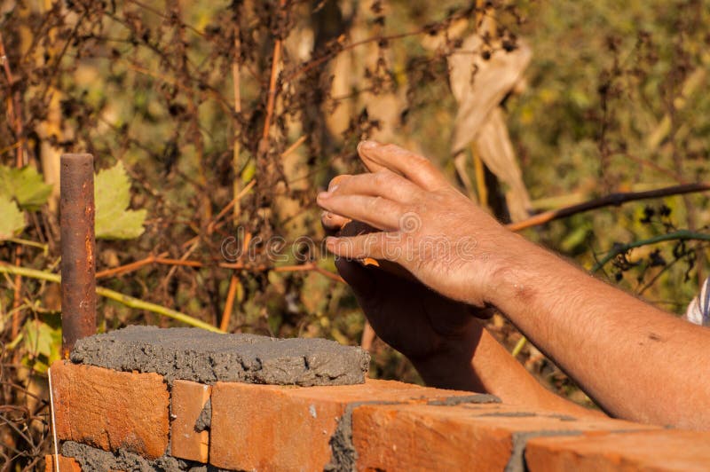Building a Wall with Red Brick. Working with Bricks for Building a Wall ...