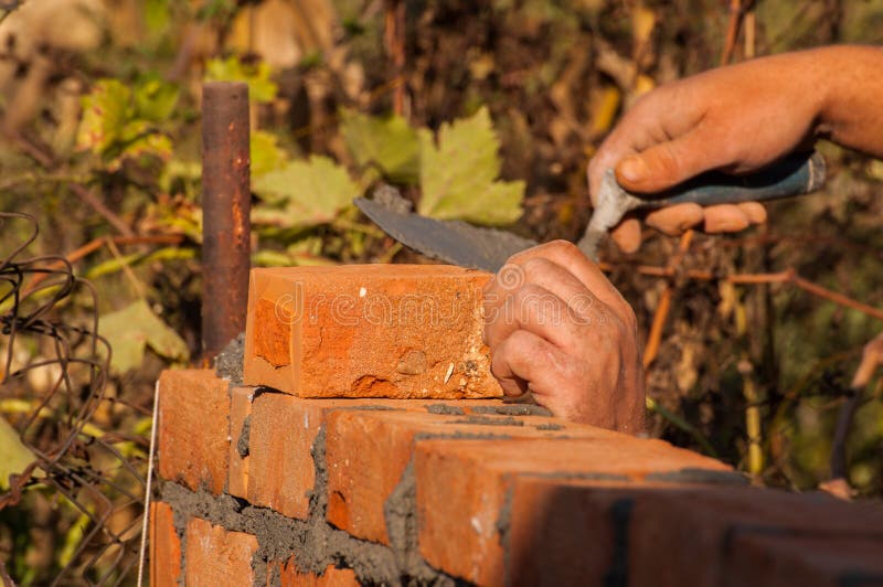 Building a Wall with Red Brick. Working with Bricks for Building a Wall ...