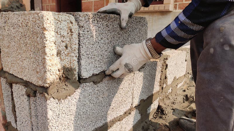 A Worker Building Wall To Bricks , Home Construction Stock Photo ...