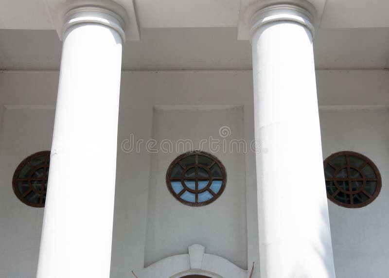 Building with White Columns and a Round Window Stock Image - Image of ...