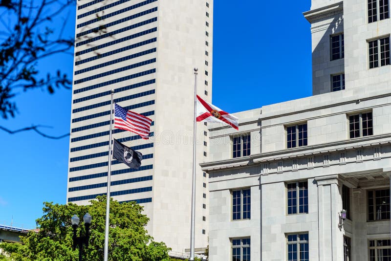 Building with Windows and Several Flagpoles with Raised Flags Stock ...