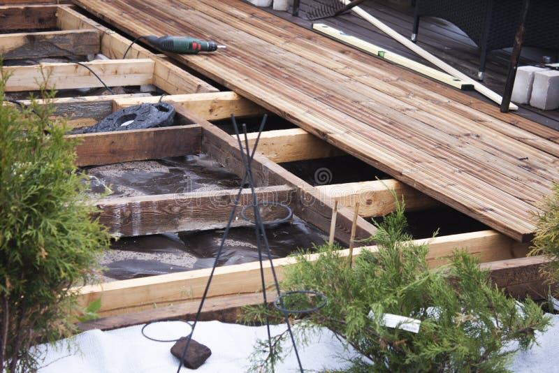 Building a wooden terrace stock image. Image of handyman - 56368713