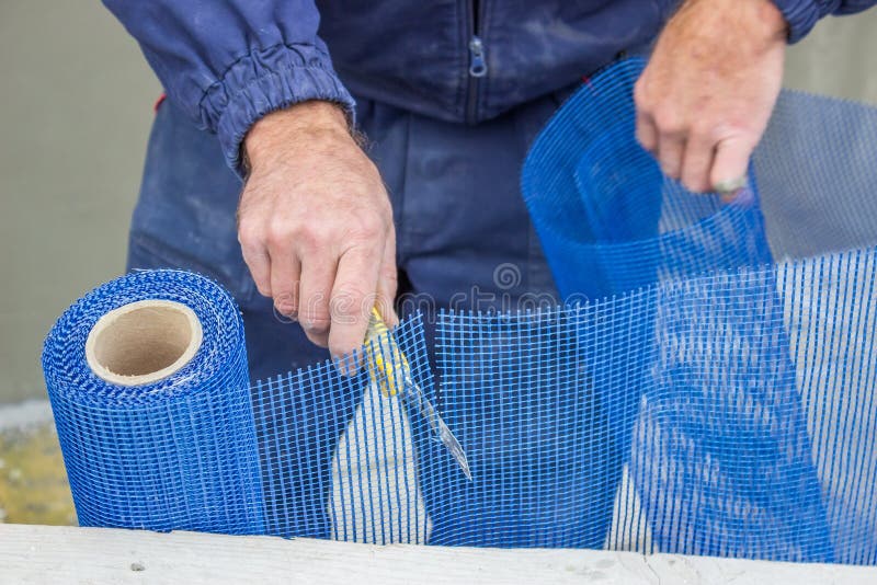 Building Worker Cutting Plastic Grid with Cutter 2 Stock Photo - Image ...