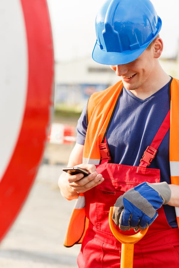 Building Worker Using a Phone Stock Photo - Image of helmet, site: 72767862