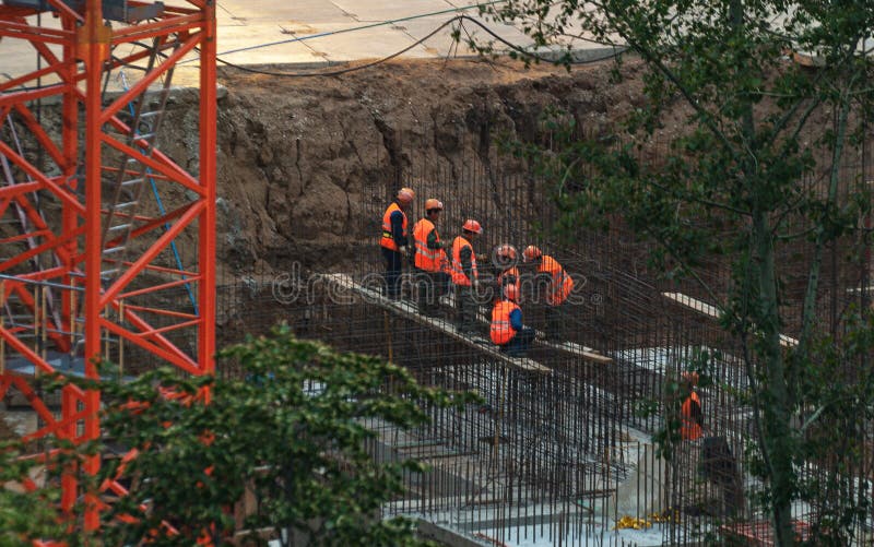 Building Workers Team Stand in a Row in Construction Site Pit Editorial ...