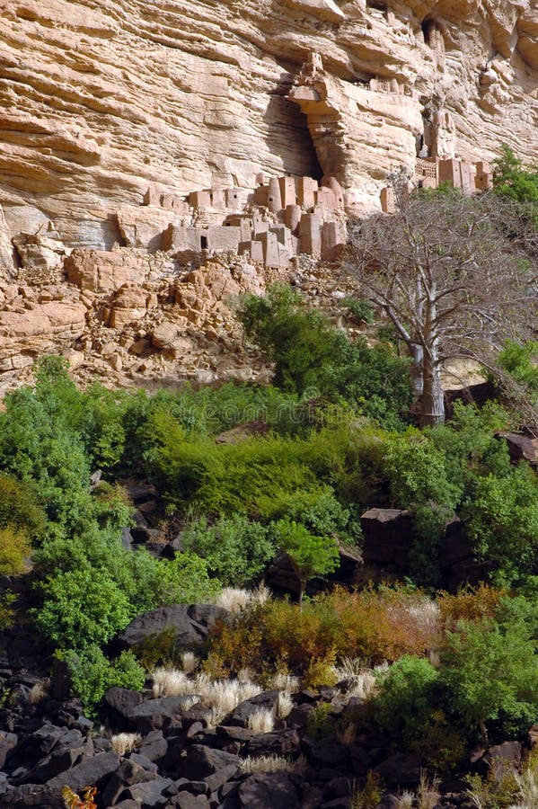 Buildings Along A Cliff Base Stock Image - Image of cliff, village ...
