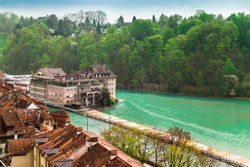 Buildings Along Edge of River Stock Image - Image of wide, flowing ...
