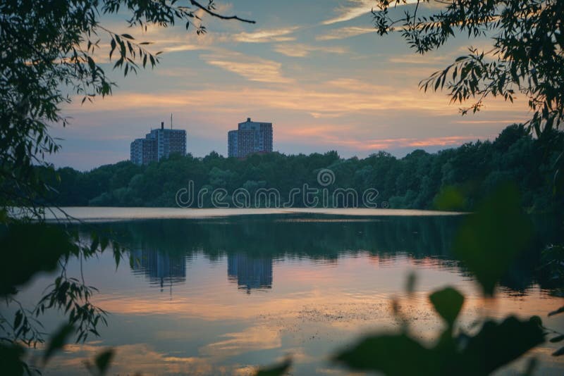 Buildings by Lake between Trees Stock Image - Image of trees, buildings ...