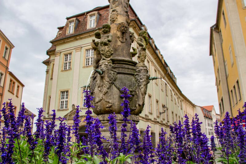 Buildings with Medieval Architecture Next To Many Flowers Editorial ...
