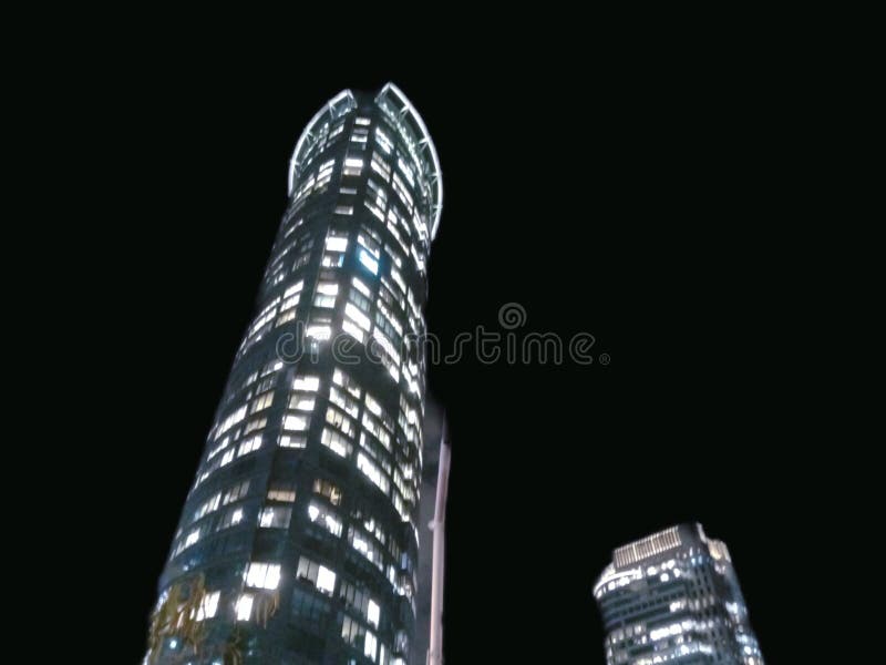 Buildings in the night editorial stock image. Image of buildings ...