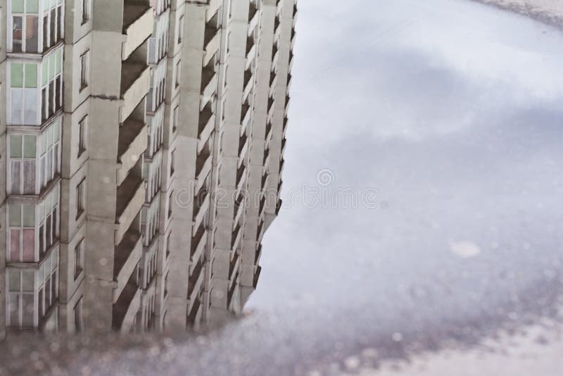 Buildings Reflection in Puddle at the City Street Stock Image - Image ...