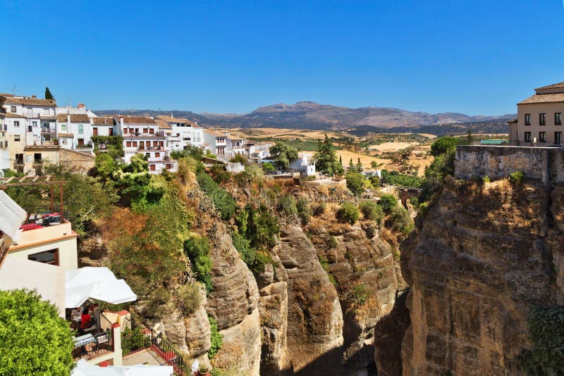 Buildings Standing on the Edge of a Cliff in Ronda, Spain Editorial ...