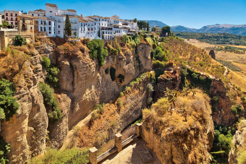 Buildings Standing on the Edge of a Cliff in Ronda, Spain Stock Photo ...