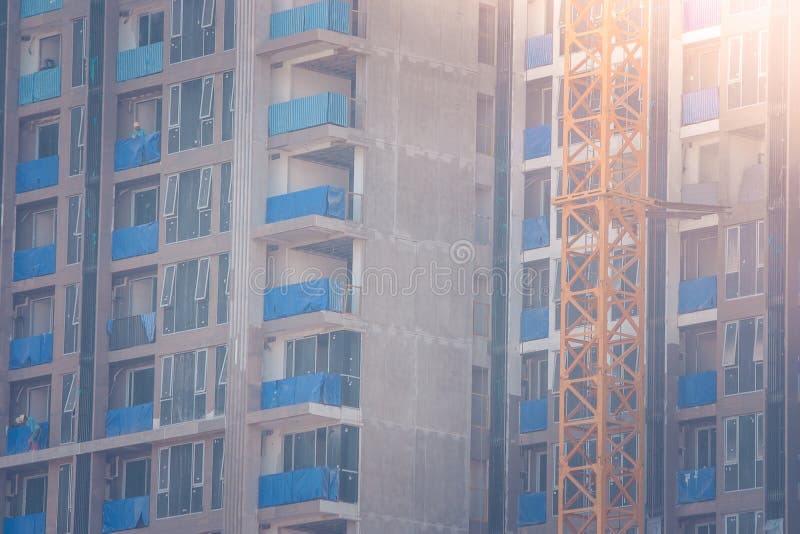 Buildings Under Construction with Yellow Construction Crane. Soft Focus ...