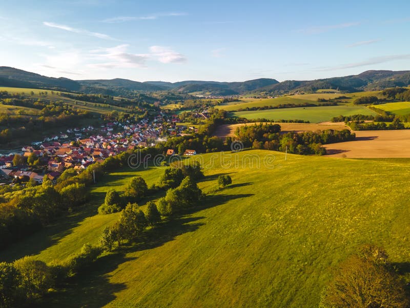 Buildings of the Village Surrounded by Grass and Trees Stock Photo ...
