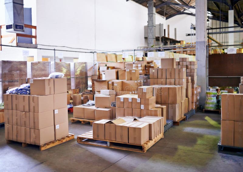 Built for Boxes. Stacked Boxes in a Large Distribution Warehouse. Stock ...
