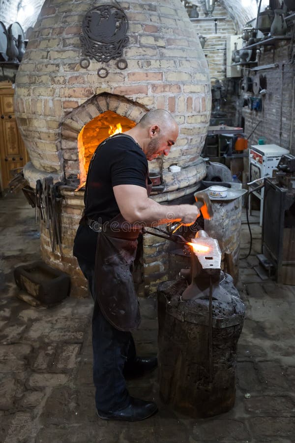 A Man Blacksmith Forging a Knife Blade Editorial Photography - Image of ...