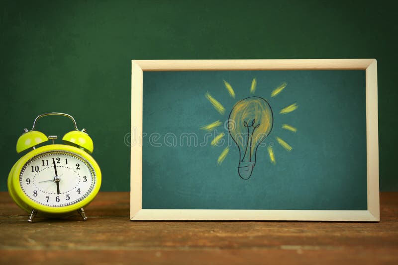 Bulb and clock stock image. Image of inspiration, illuminated - 135667445