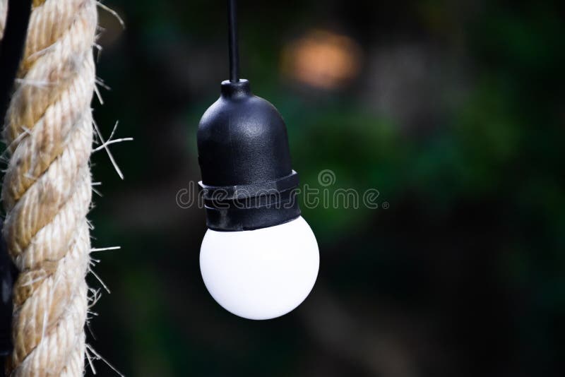Bulb hanging on wire stock photo. Image of illumination - 241711318