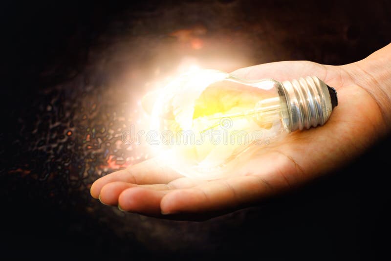 Bulb light on hand stock image. Image of inspiration - 64915699