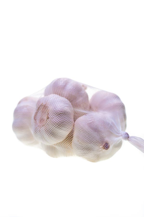 Bulbs of garlic in a bag stock photo. Image of healthy - 21812322
