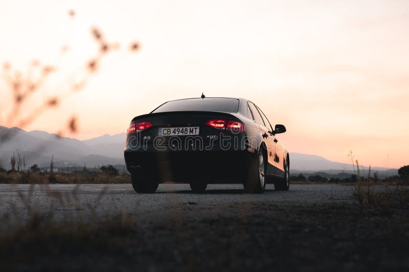 Back View of a Black Audi S4 with Beautiful Sunset in the Background ...