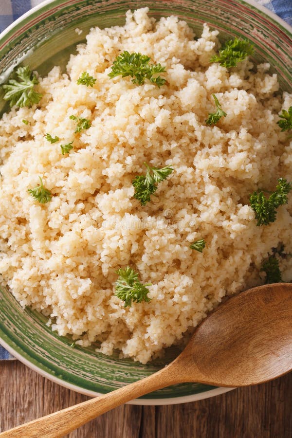 Bulgur with Parsley Macro on a Plate on the Table. Vertical Top Stock ...